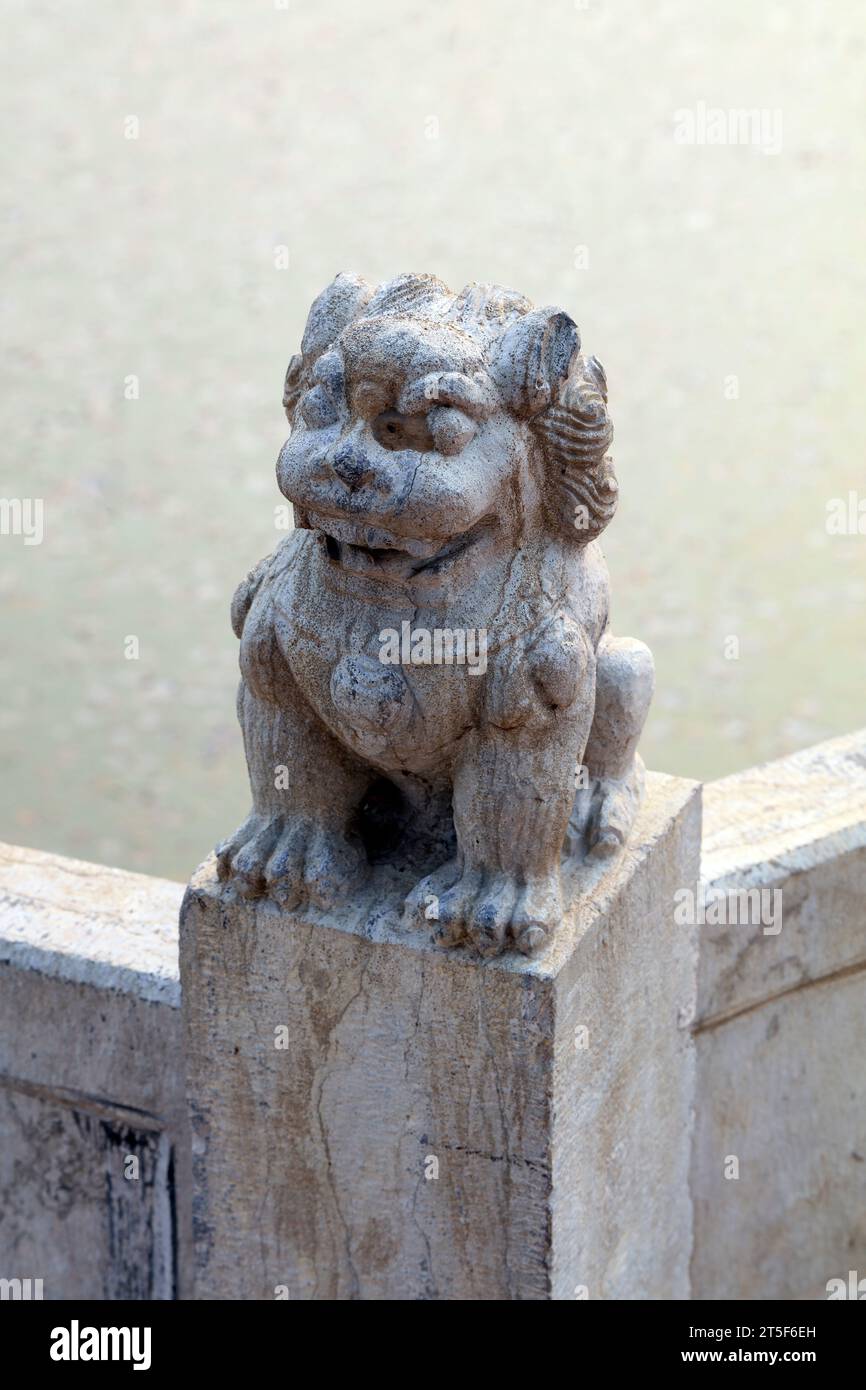 Ancient Chinese stone lion sculpture Stock Photo - Alamy
