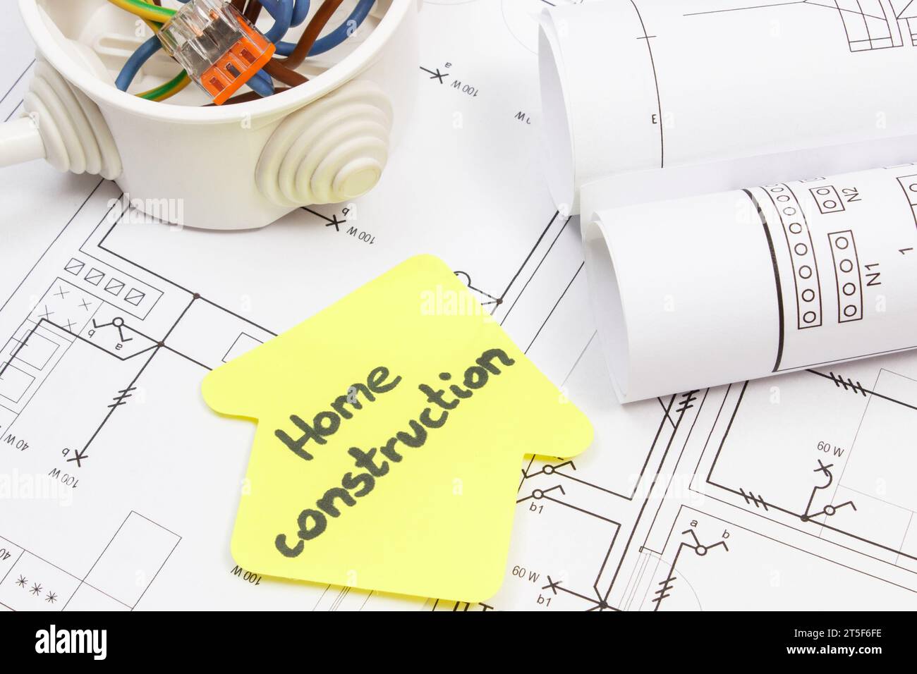 House shape with inscription home construction, electric box with ...