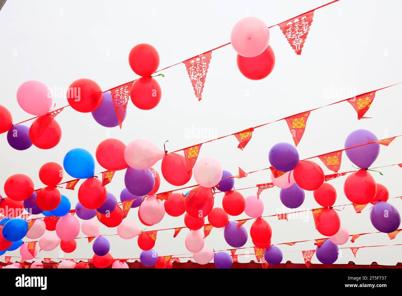 Festive balloons and coloured flags Stock Photo - Alamy