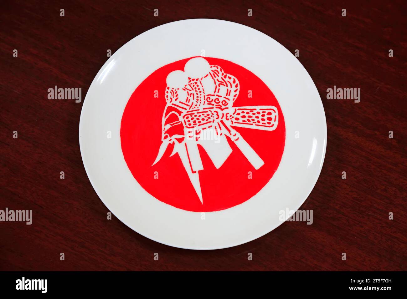 Ceramic plate paper-cut characters Stock Photo - Alamy