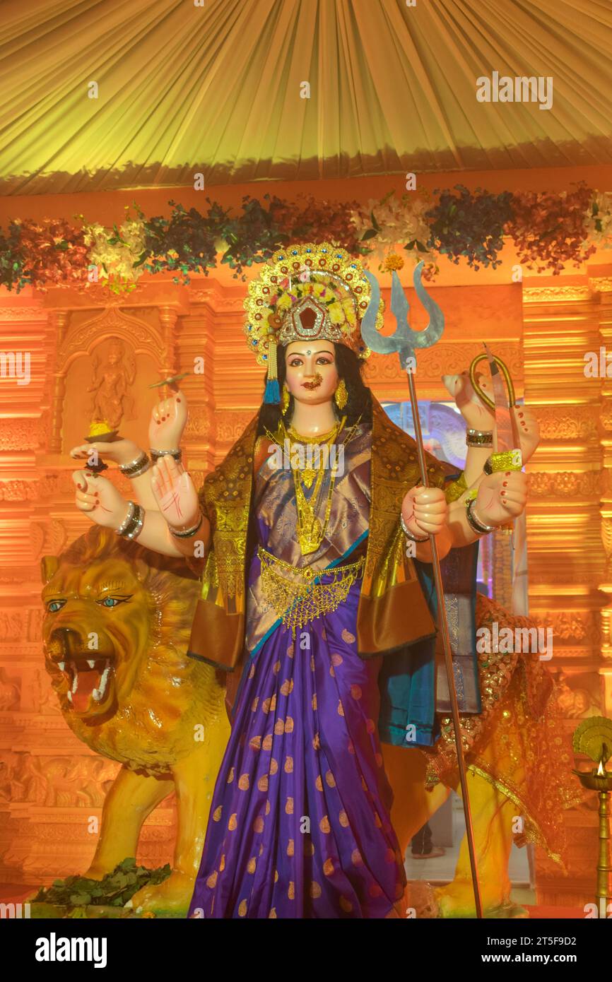A beautiful idol of Maa Durga being worshipped at a pandal during ...