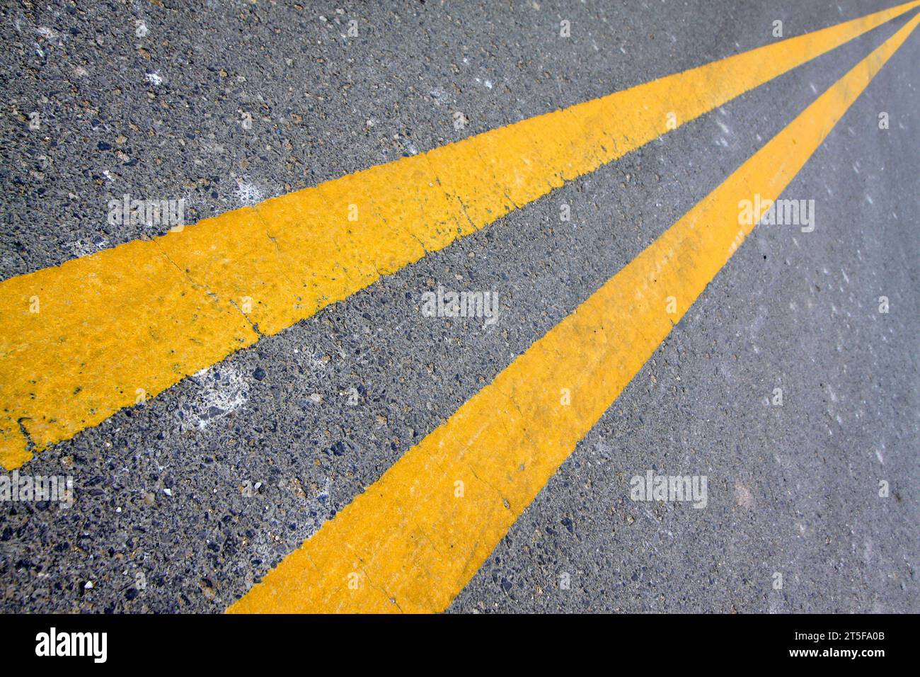 yellow double solid line on the road Stock Photo - Alamy