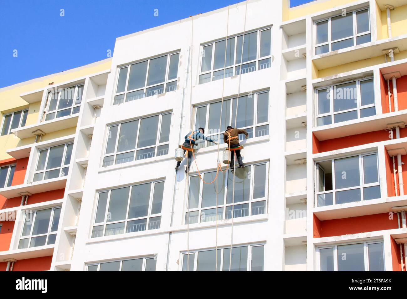 painter in high rise buildings, north china Stock Photo - Alamy