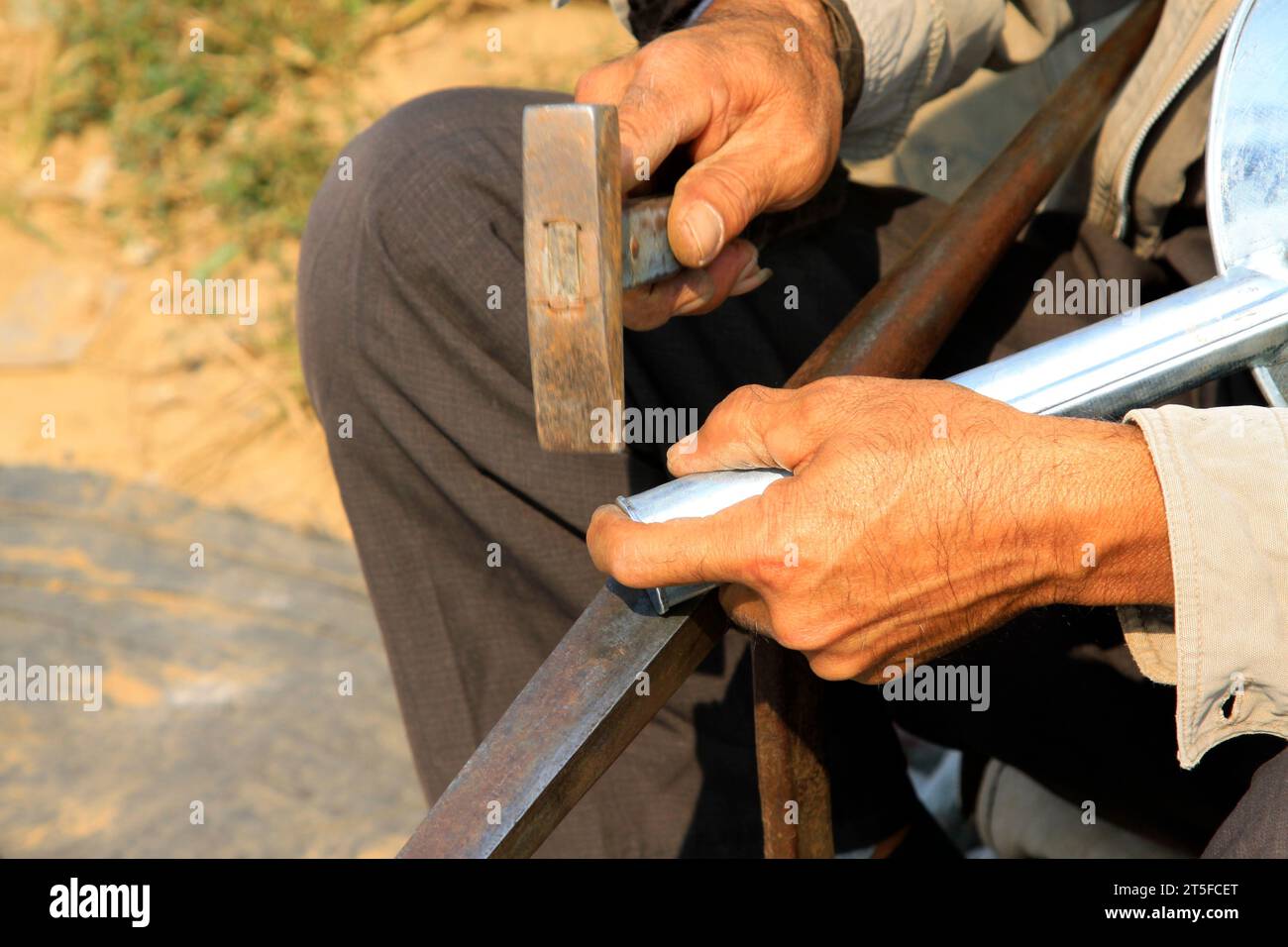 Worker metal craftsman, an artisan detail, tradition and old work Stock ...