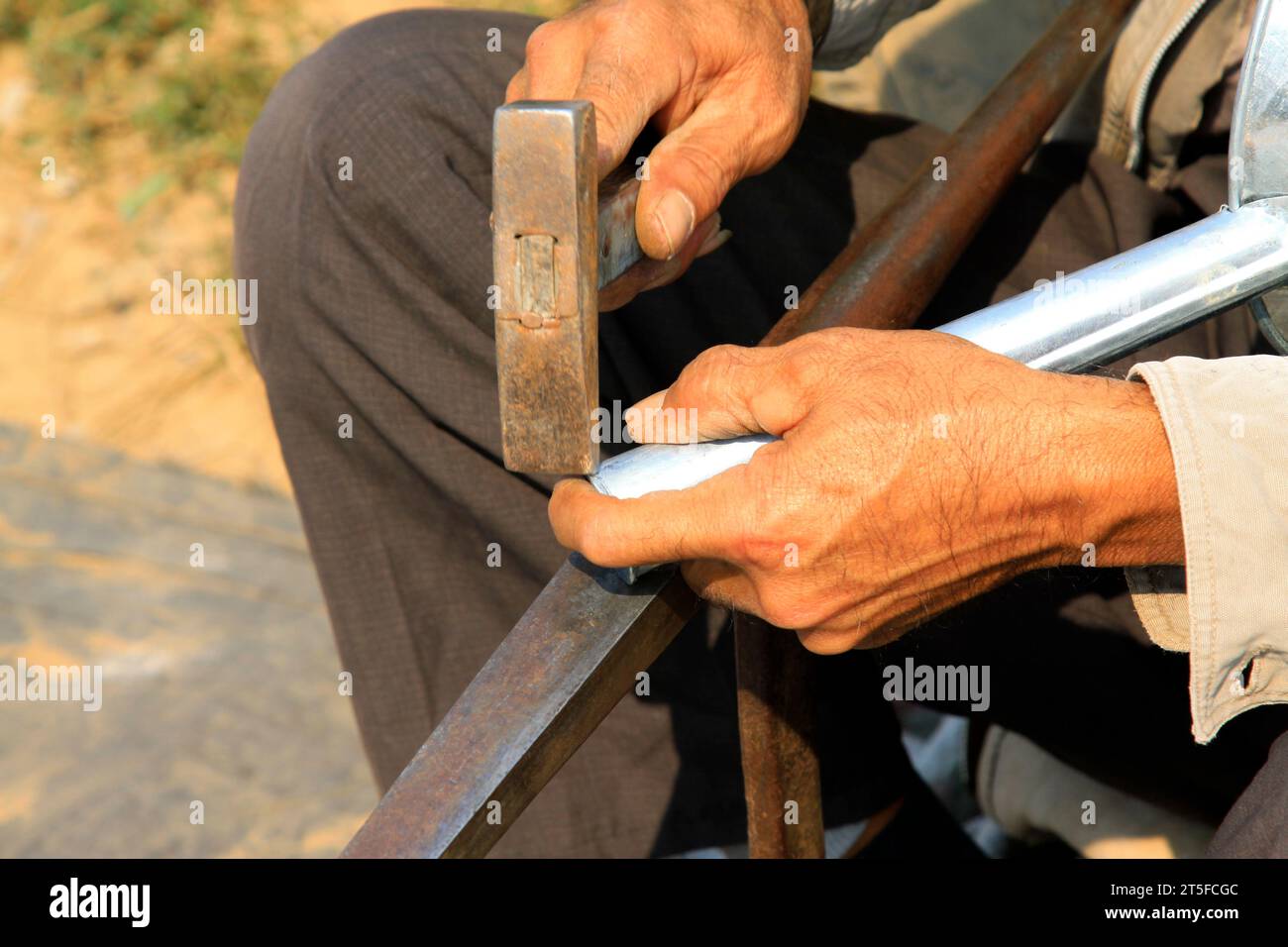 Worker metal craftsman, an artisan detail, tradition and old work Stock ...