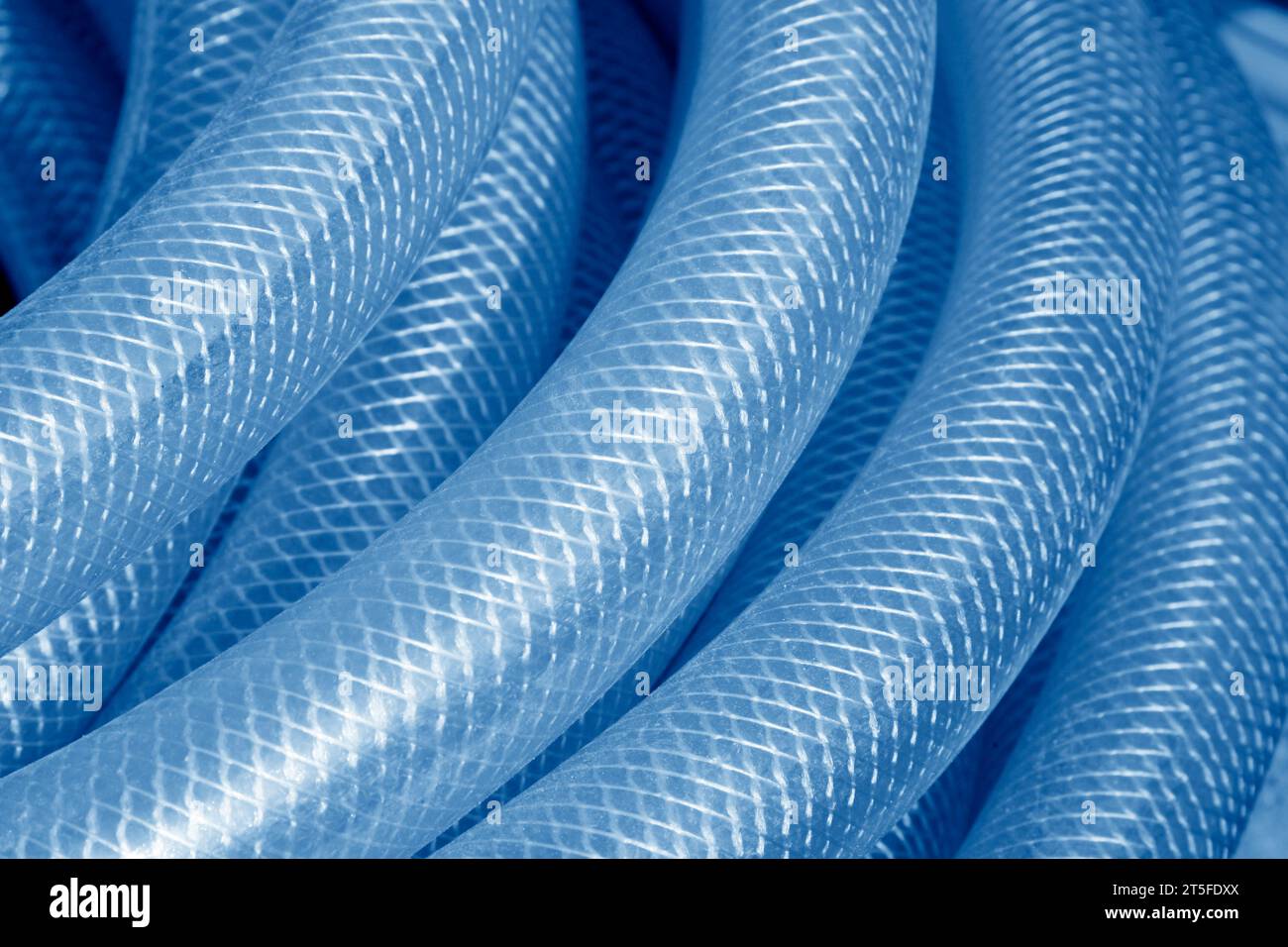 blue plastic pipe stacked toghter at a construction site Stock Photo ...