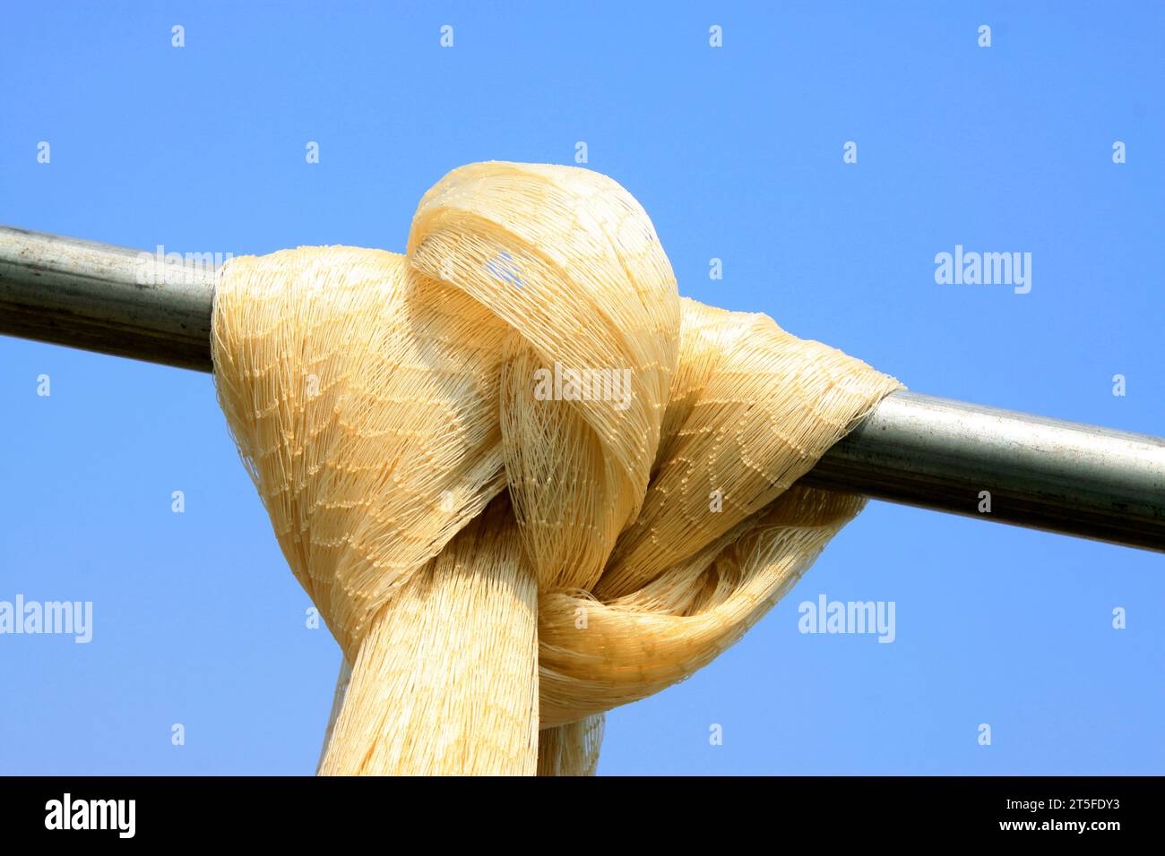 Nylon fishing nets hanging on iron rod, closeup of photo Stock Photo ...