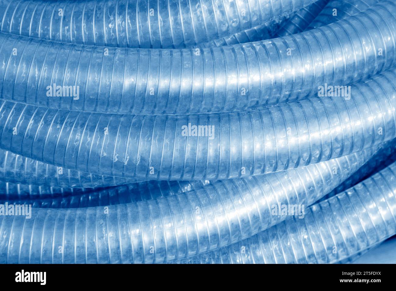 blue plastic pipe stacked toghter at a construction site Stock Photo ...