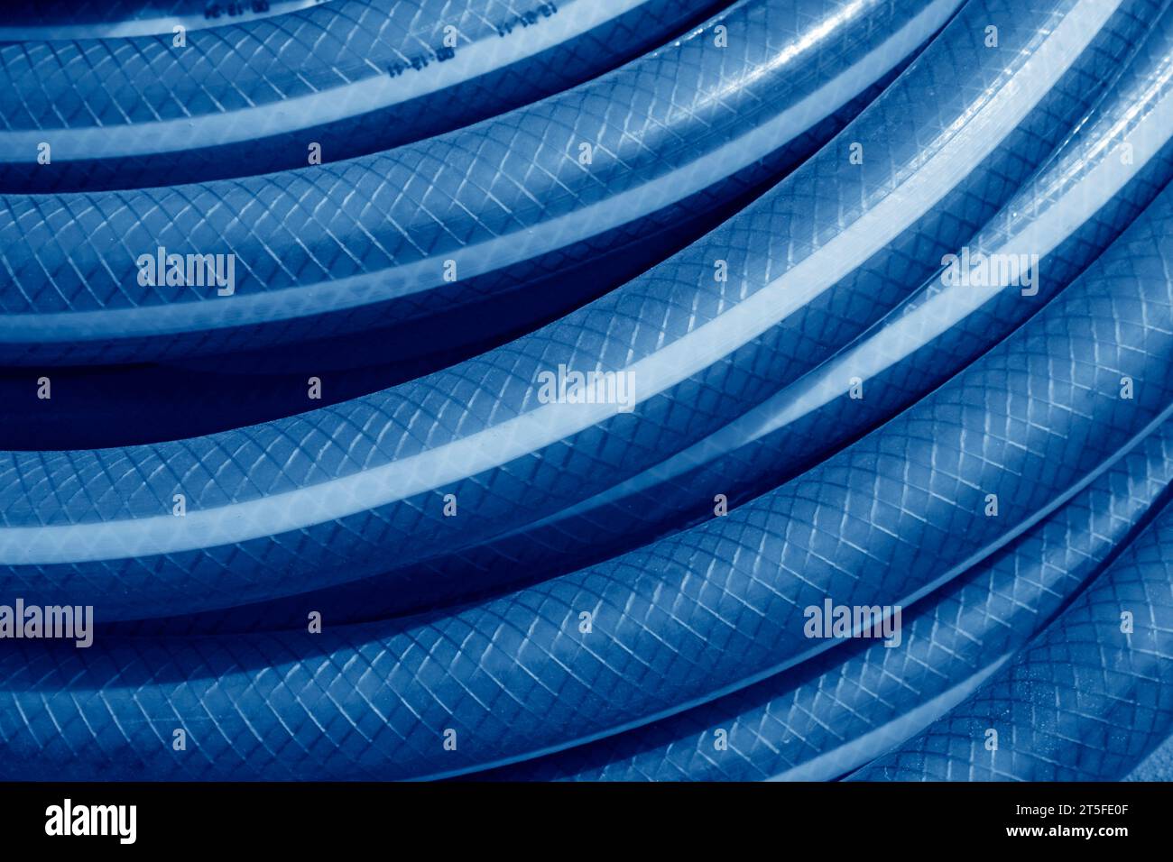 blue plastic pipe stacked toghter at a construction site Stock Photo ...