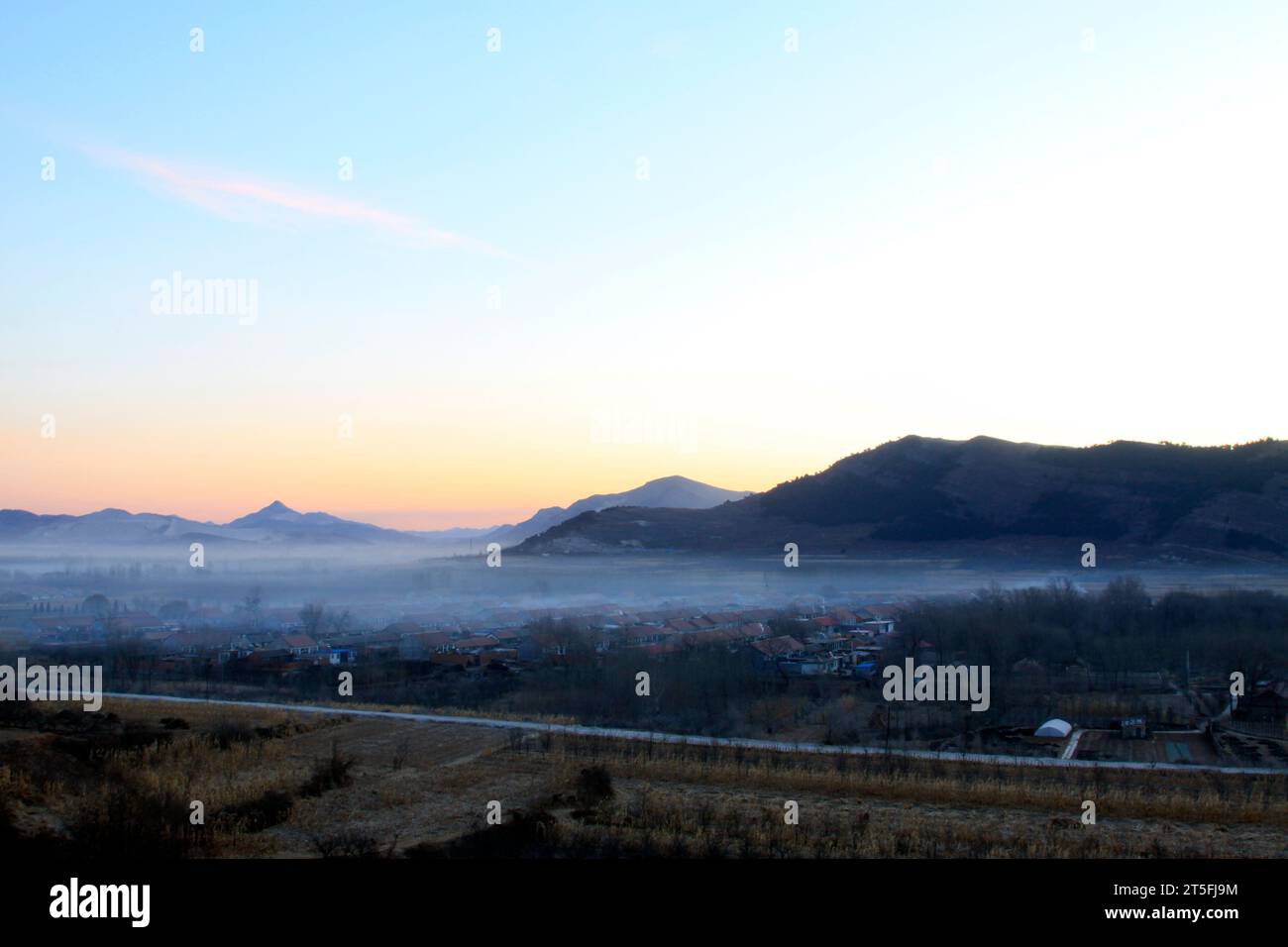 small mountain village scenery in the mist, north china Stock Photo - Alamy