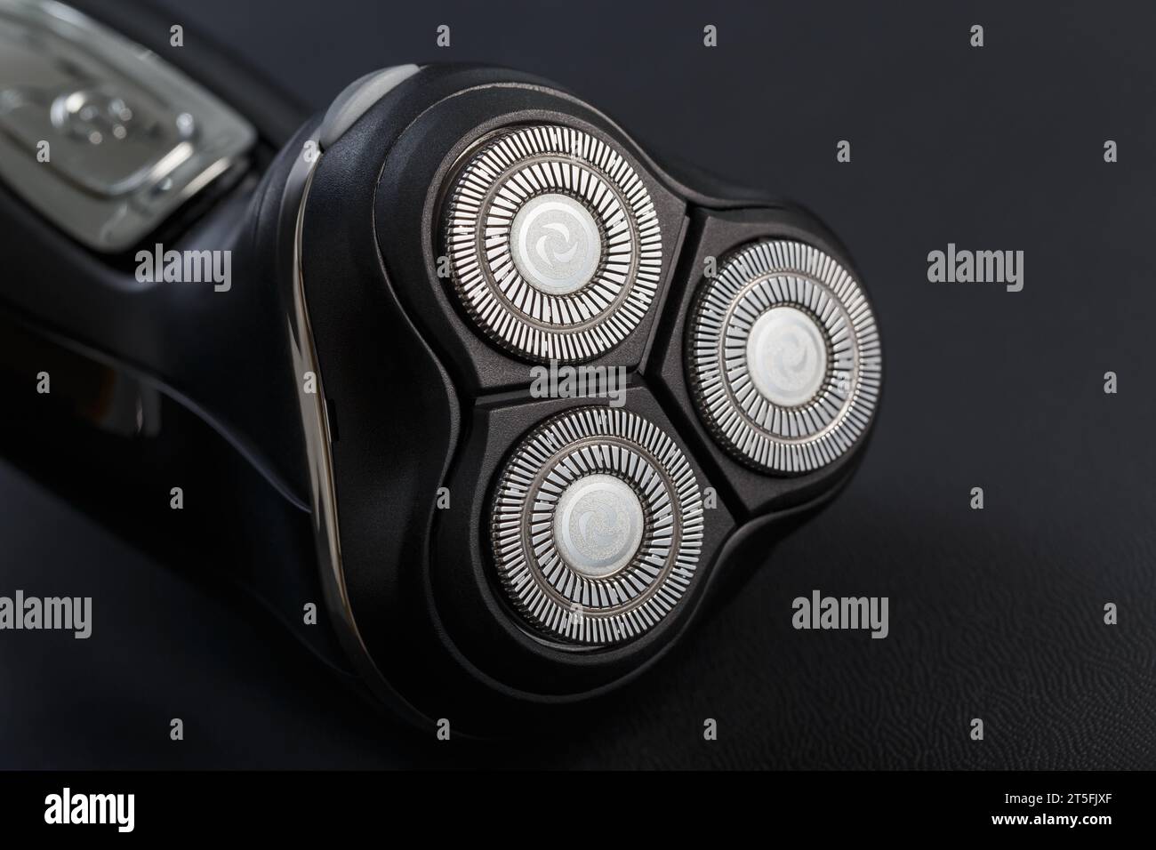 Three floating knives on a modern electric razor. Close-up Stock Photo ...