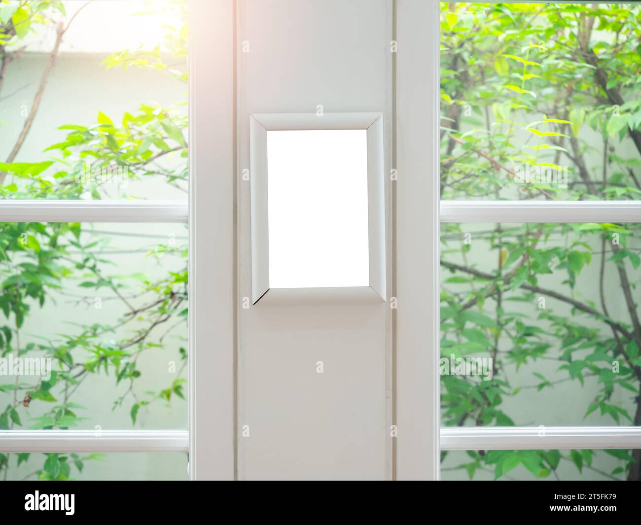 Mockup empty white vertical photo frame on vintage glass window with ...