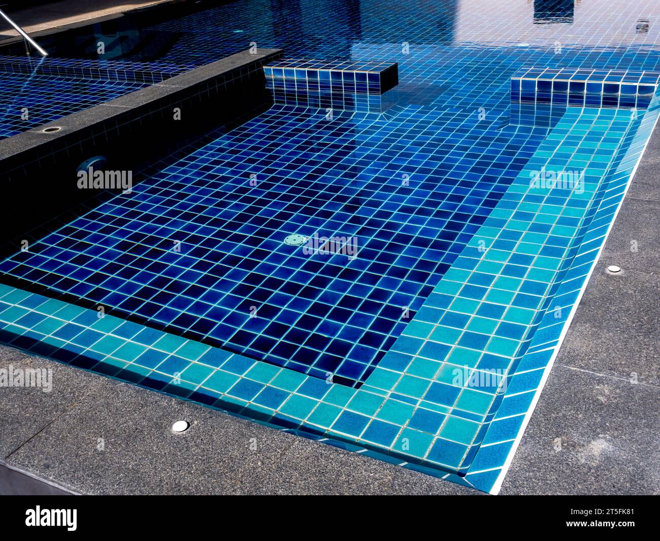 Floating bench seat, sitting zone in swimming pool with clean clear ...