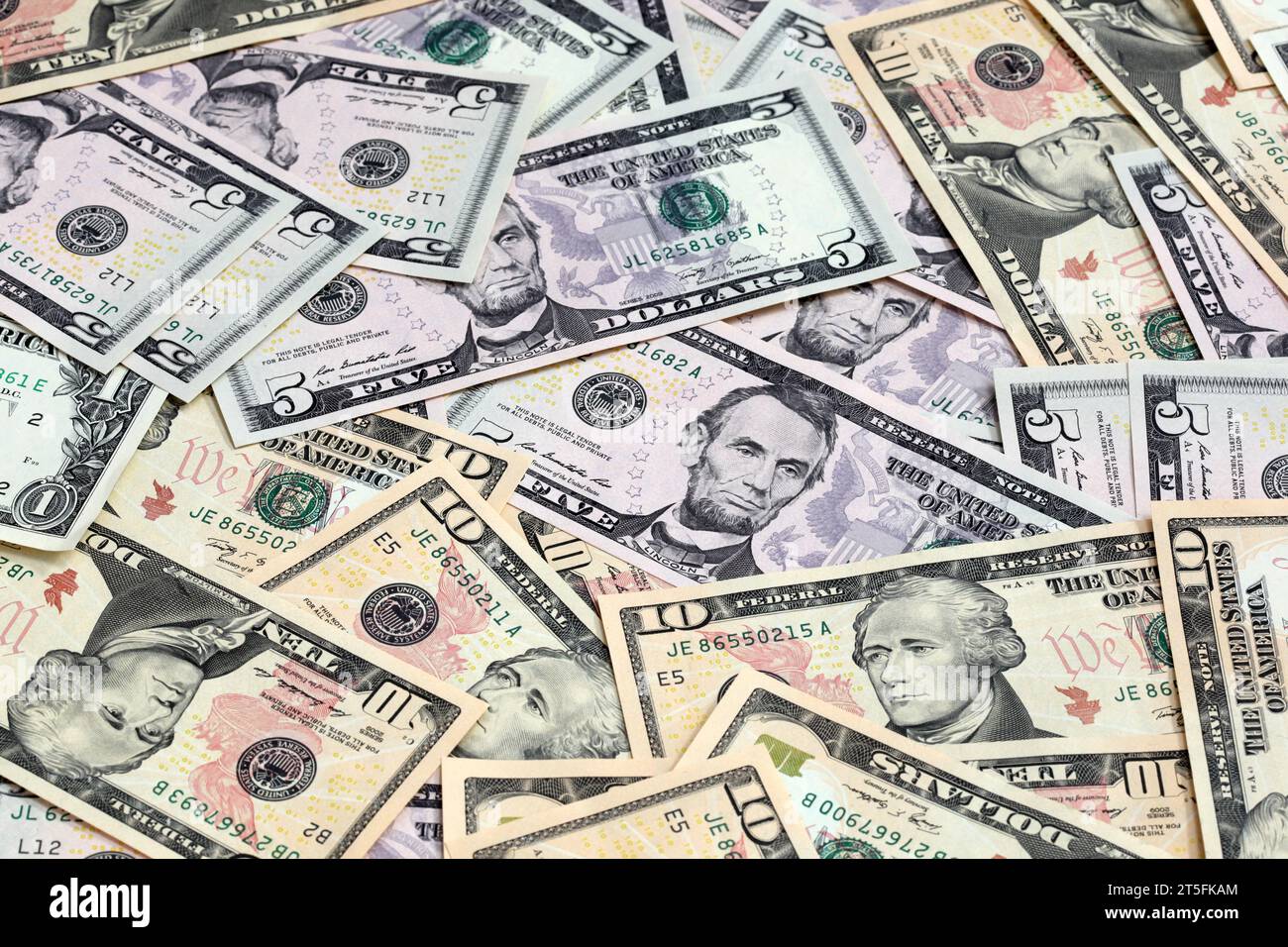 Various US dollar notes scattered. No complete notes shown and angled ...