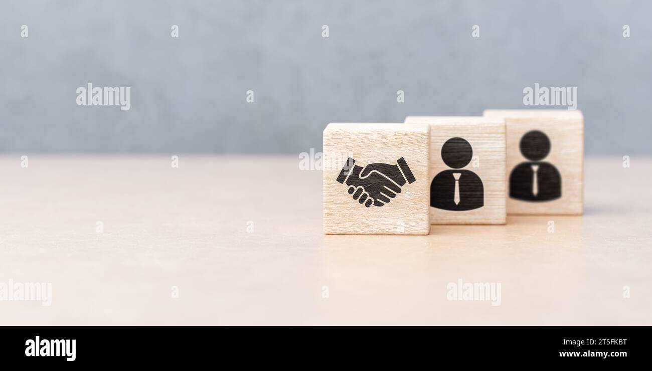 handshake. business contract. hand shaking on wooden cube for business ...
