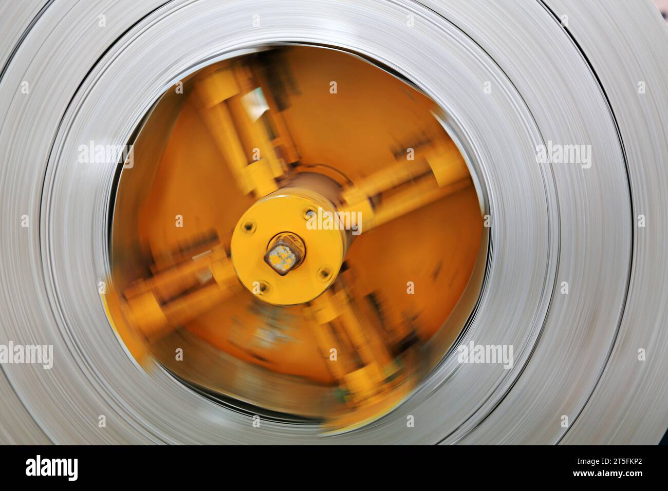 rolls of strip in a production line, in a manufacturing factory ...
