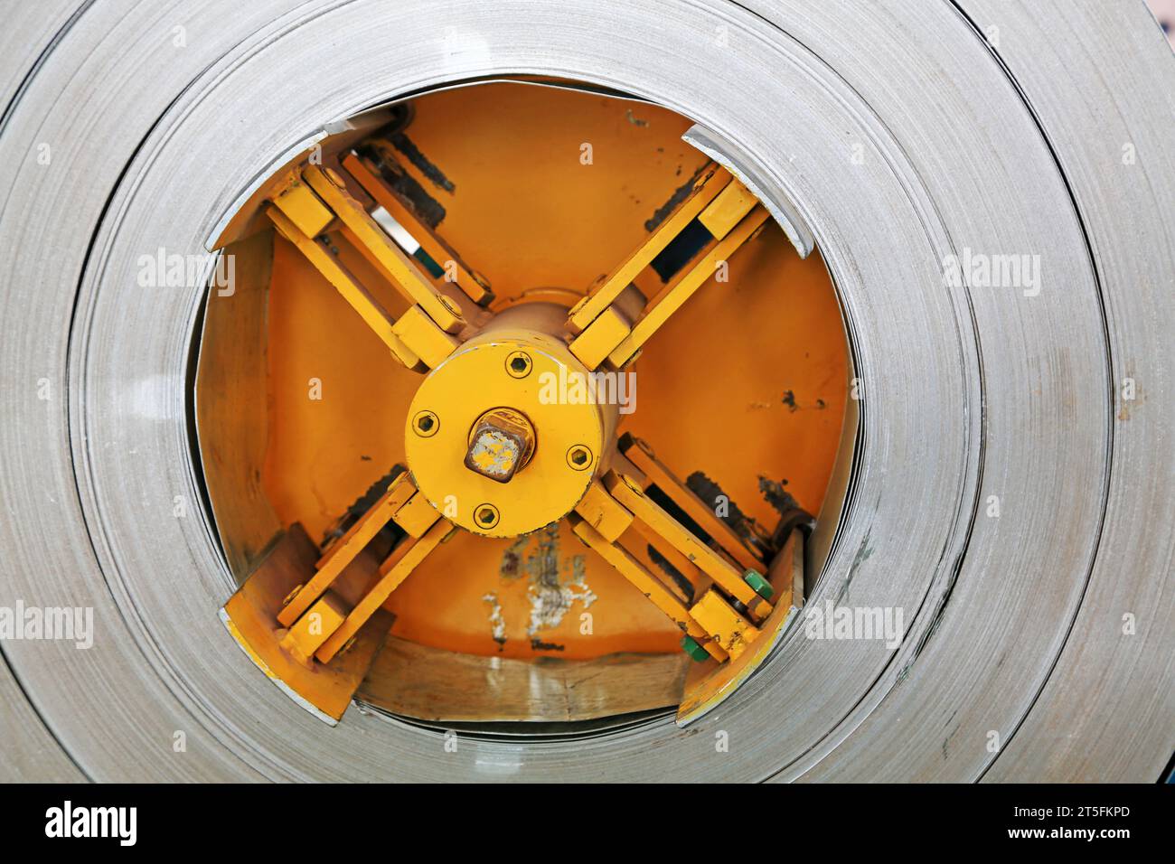rolls of strip in a production line, in a manufacturing factory ...