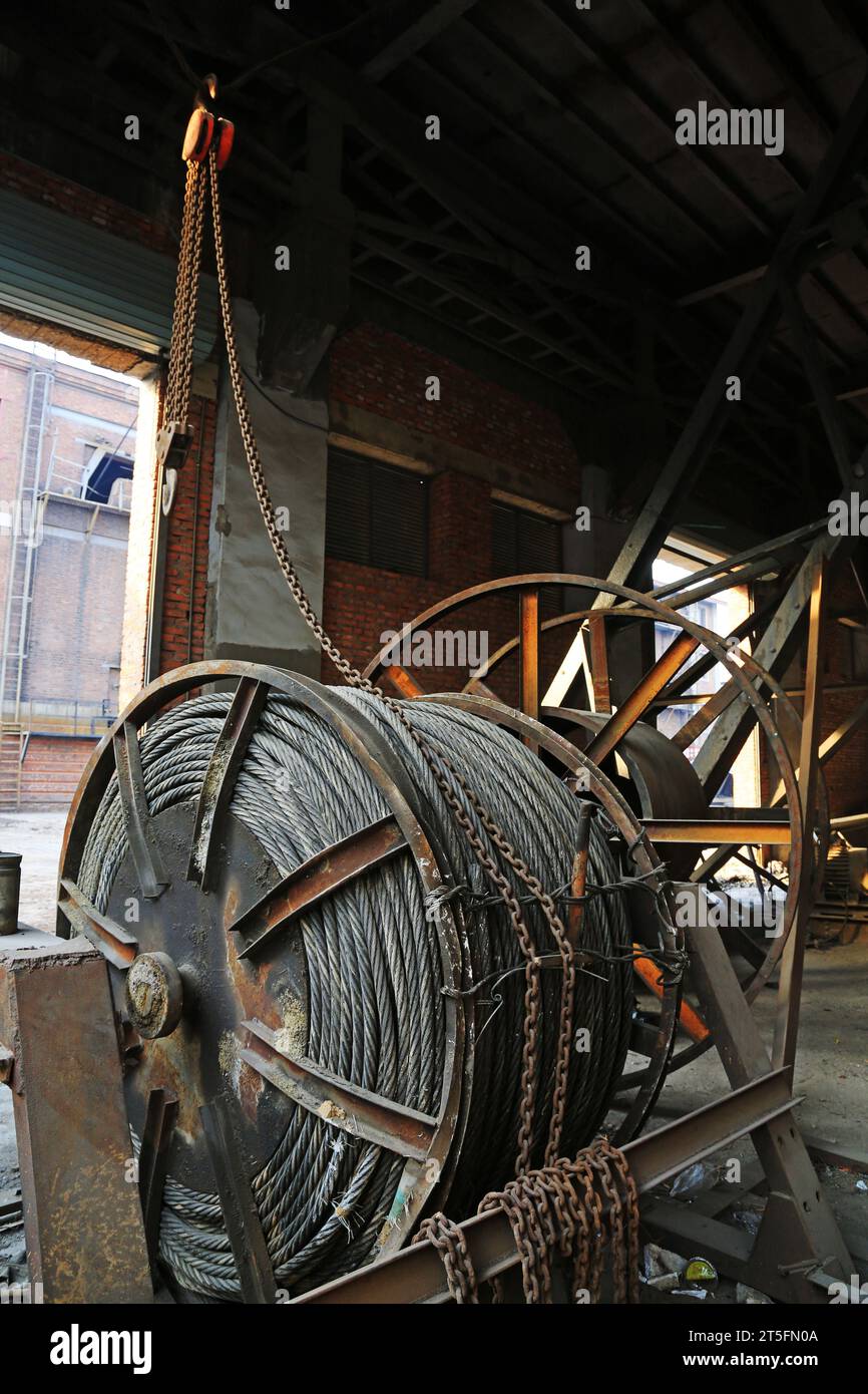 steel wire rope drum full of sludge in a factory Stock Photo - Alamy