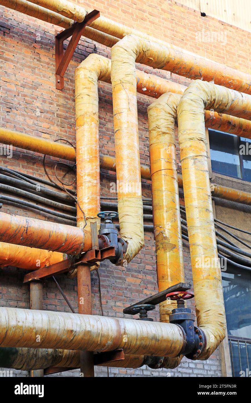 material pipe wrapped in thermal insulation in a factory Stock Photo ...