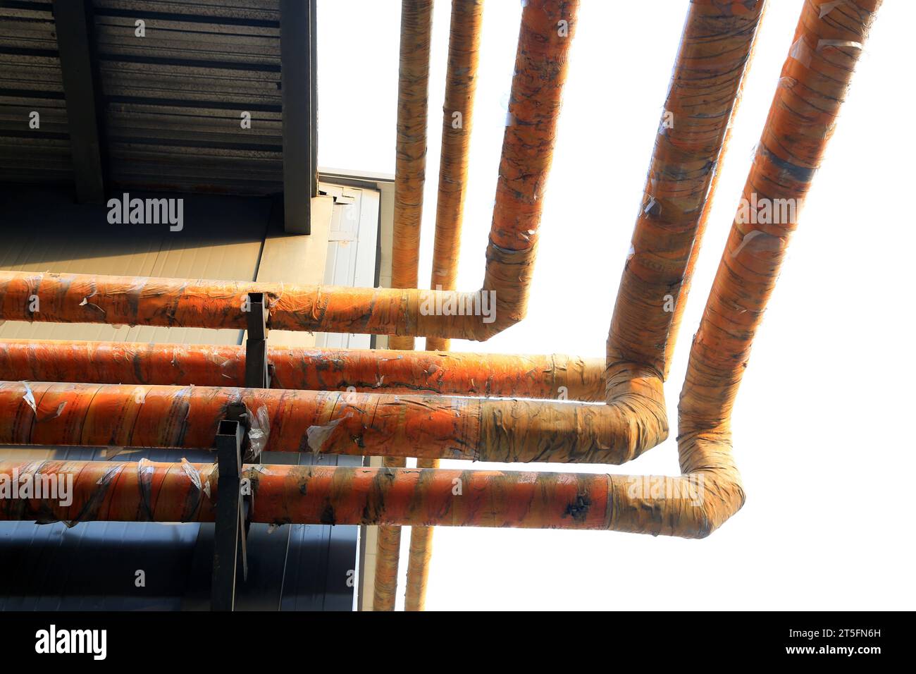 material pipe wrapped in thermal insulation in a factory Stock Photo ...