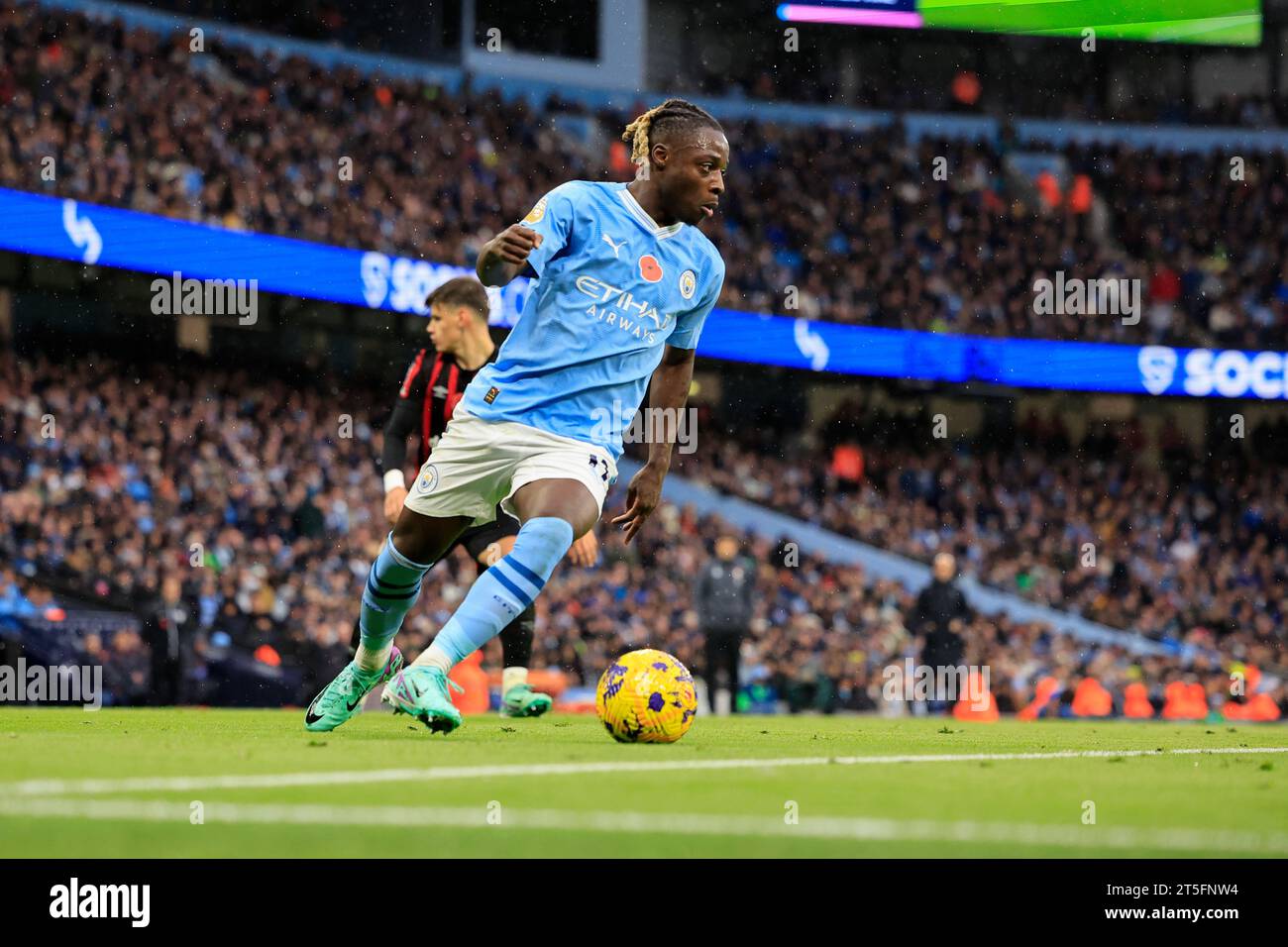 Jeremy Doku #11 of Manchester City runs into attack during the Premier ...