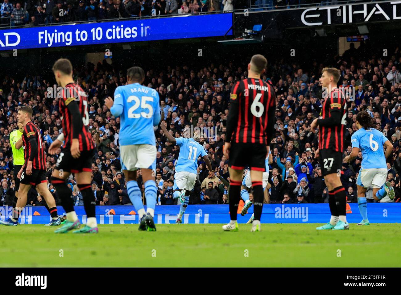 Jeremy Doku #11 of Manchester City celebrates scoring to make it 3-0 ...