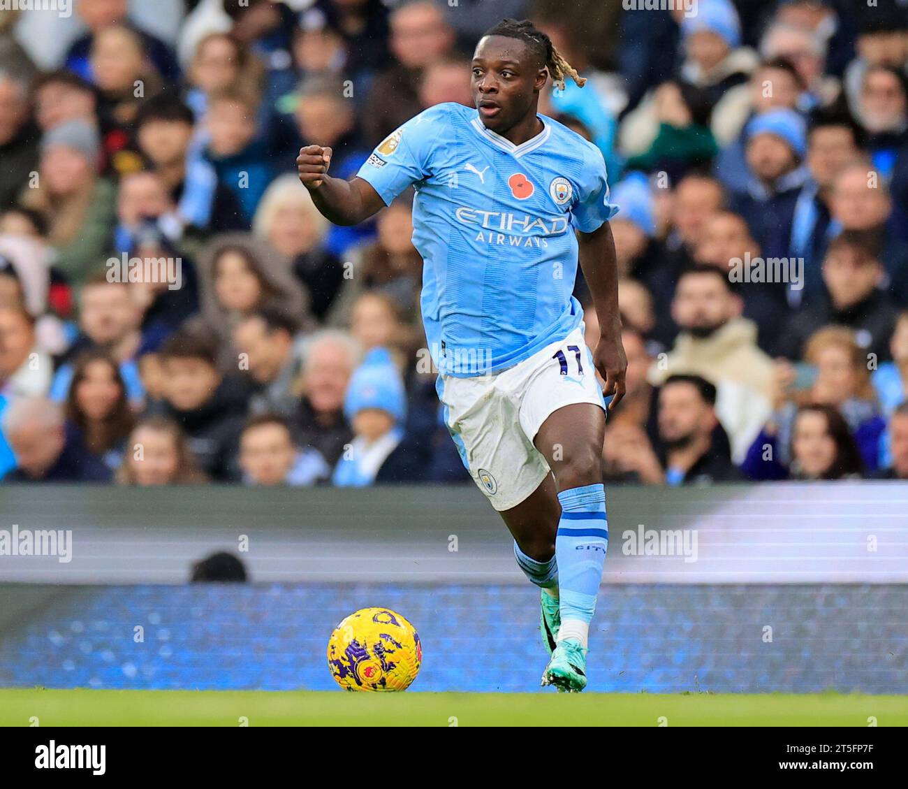 Jeremy Doku #11 of Manchester City runs into attack during the Premier ...