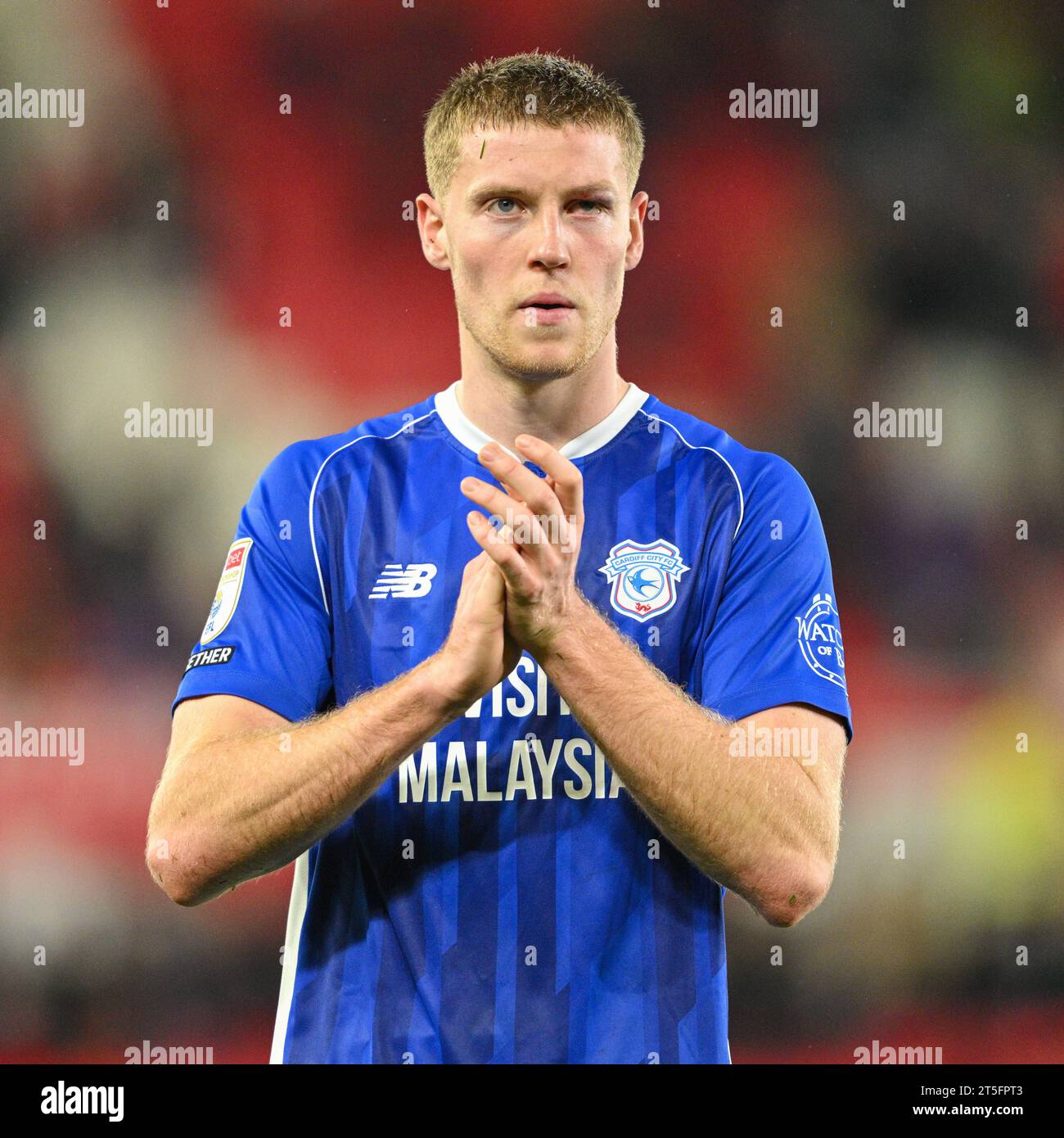 Mark McGuinness 5# of Cardiff City Association Football Club claps fans ...