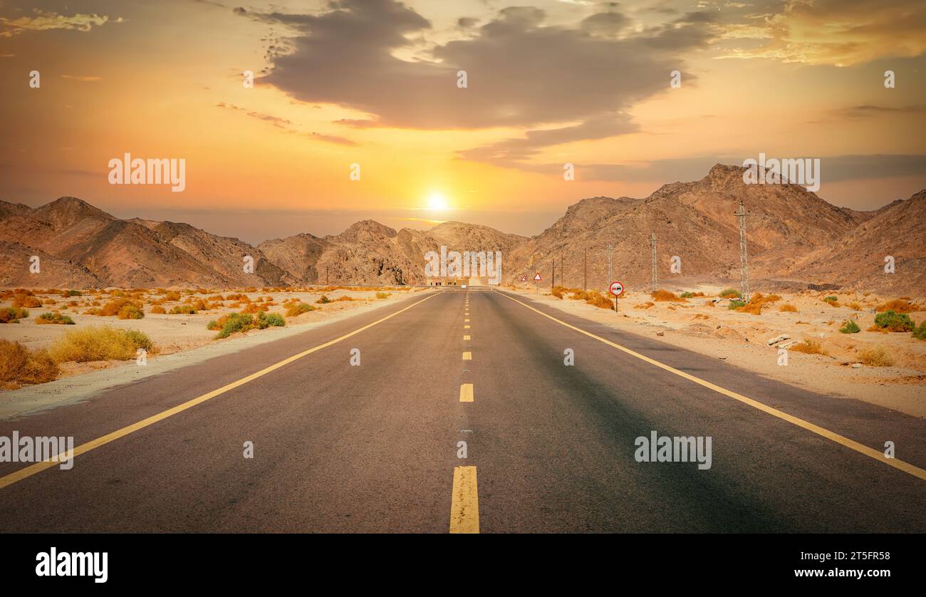 Road in the mountains of the Egyptian desert and pyramids Stock Photo ...