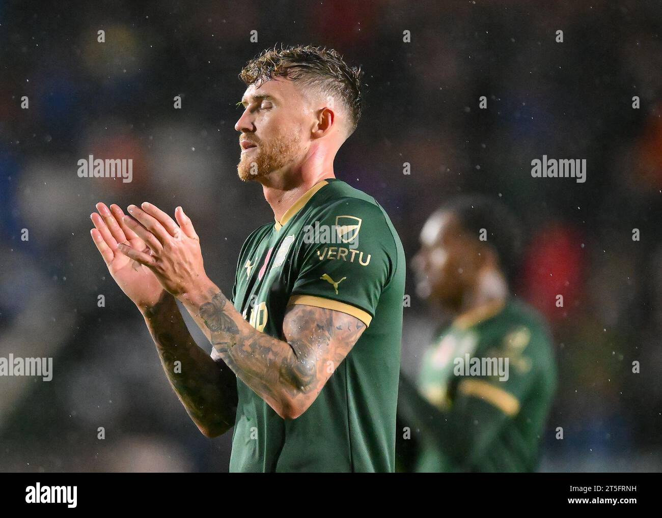 Dan Scarr #6 of Plymouth Argyle applauds the fans at full time looks ...