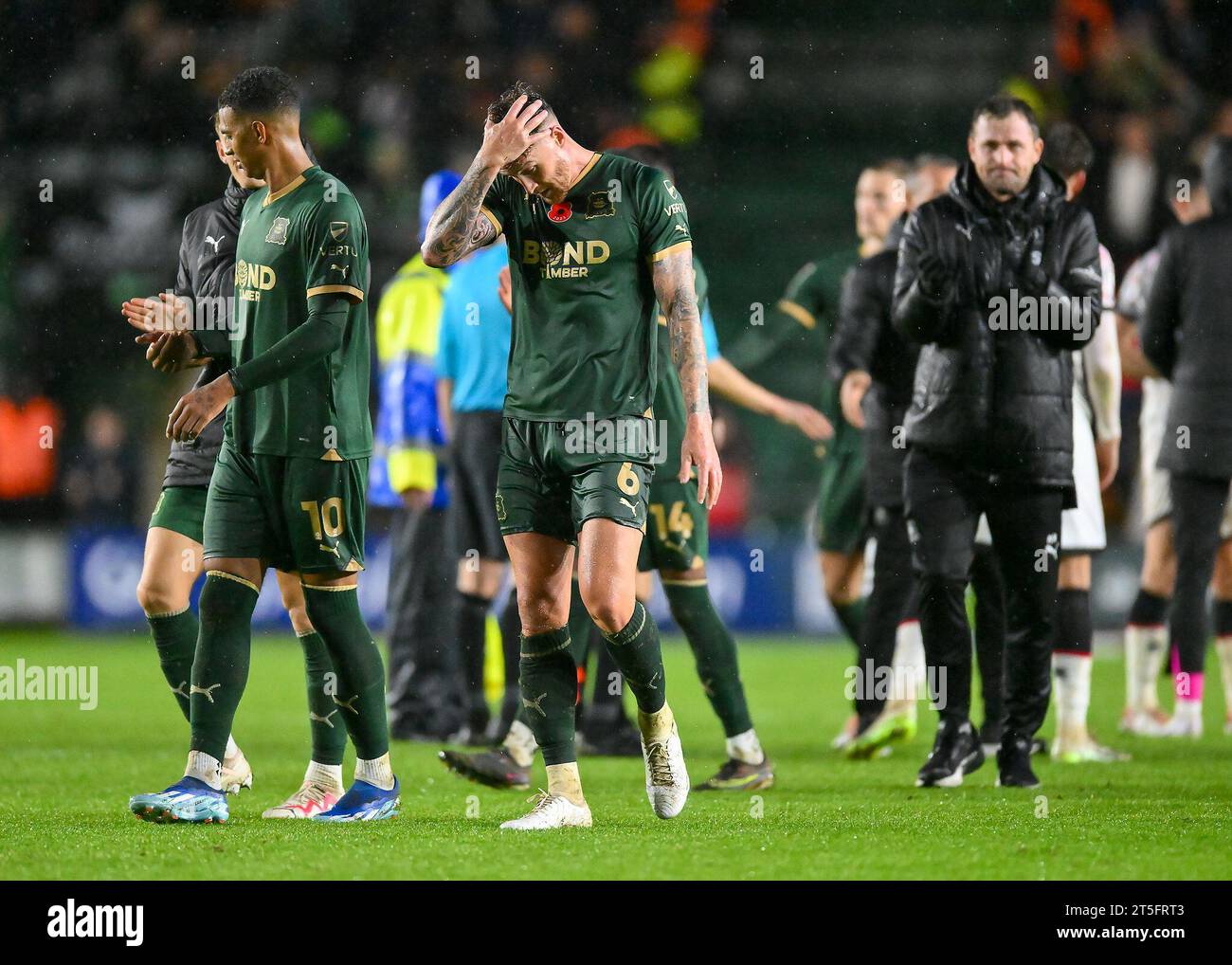 Dan Scarr #6 of Plymouth Argyle applauds the fans at full time looks ...
