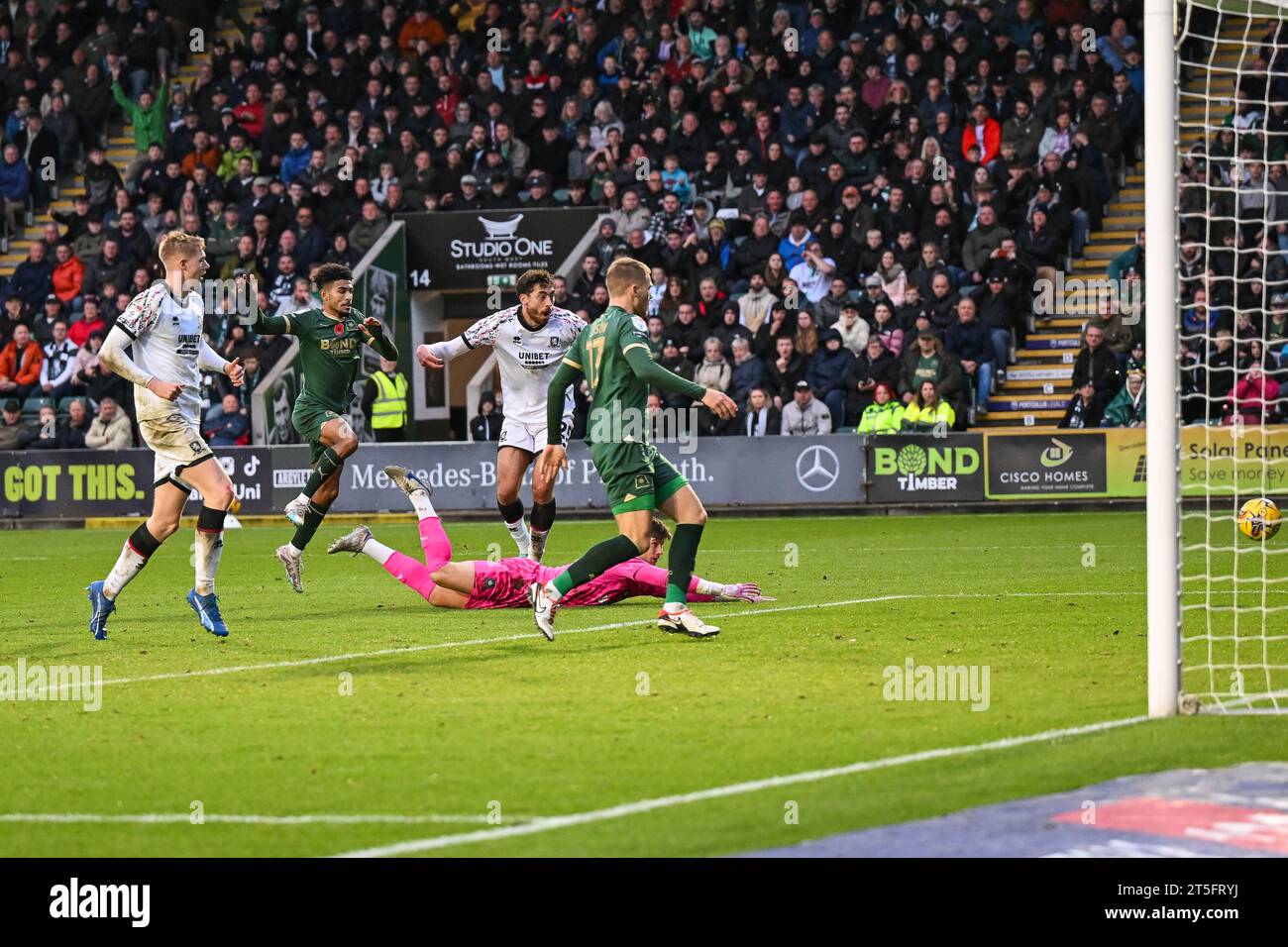Matt Crooks #25 of Middlesbrough rounds Michael Cooper #1 of Plymouth ...