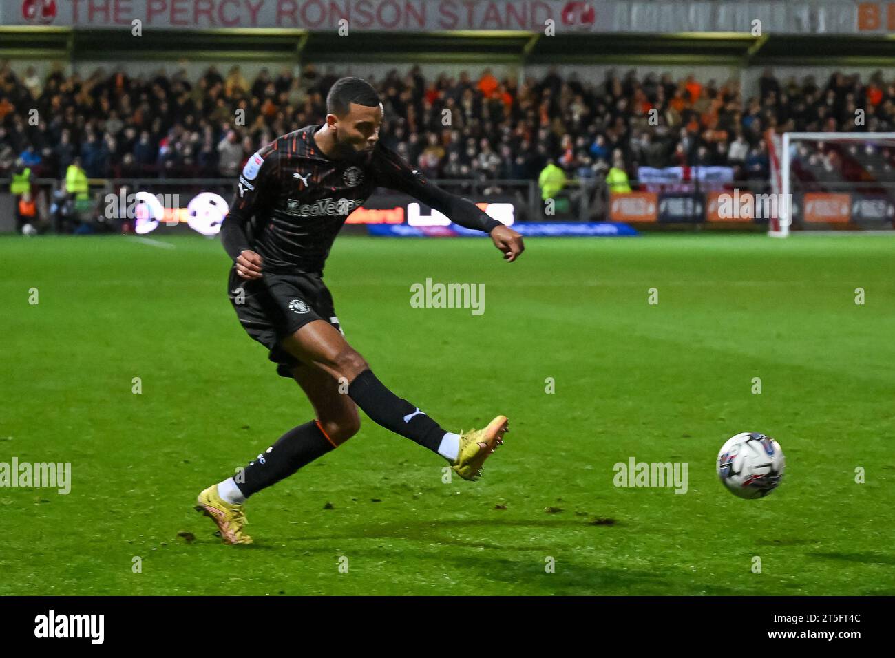 CJ Hamilton #22 of Blackpool crosses the ball during the Sky Bet League ...