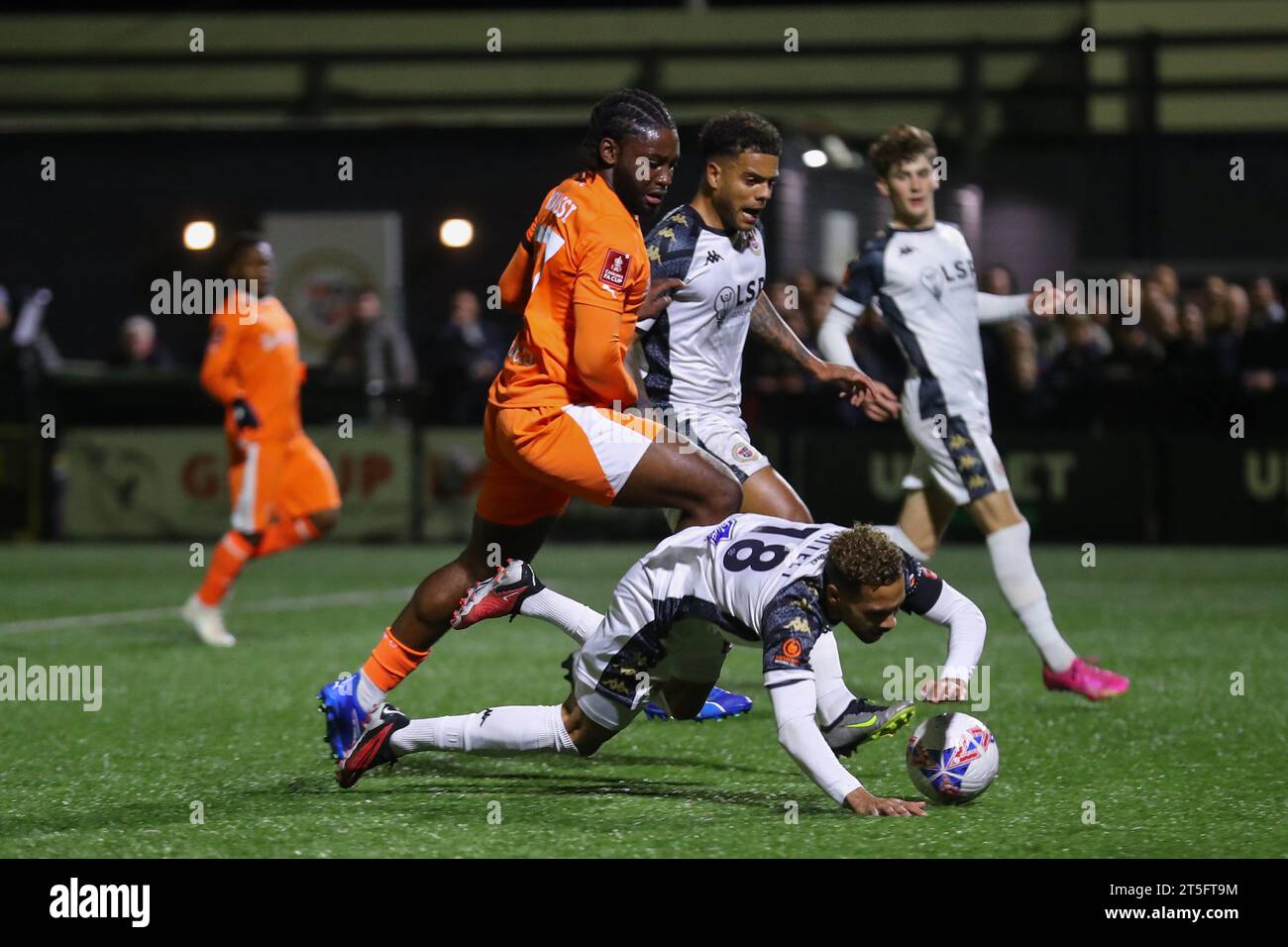 Kylian Kouassi #27 of Blackpool fouls Corey Whitely #18 of Bromley ...