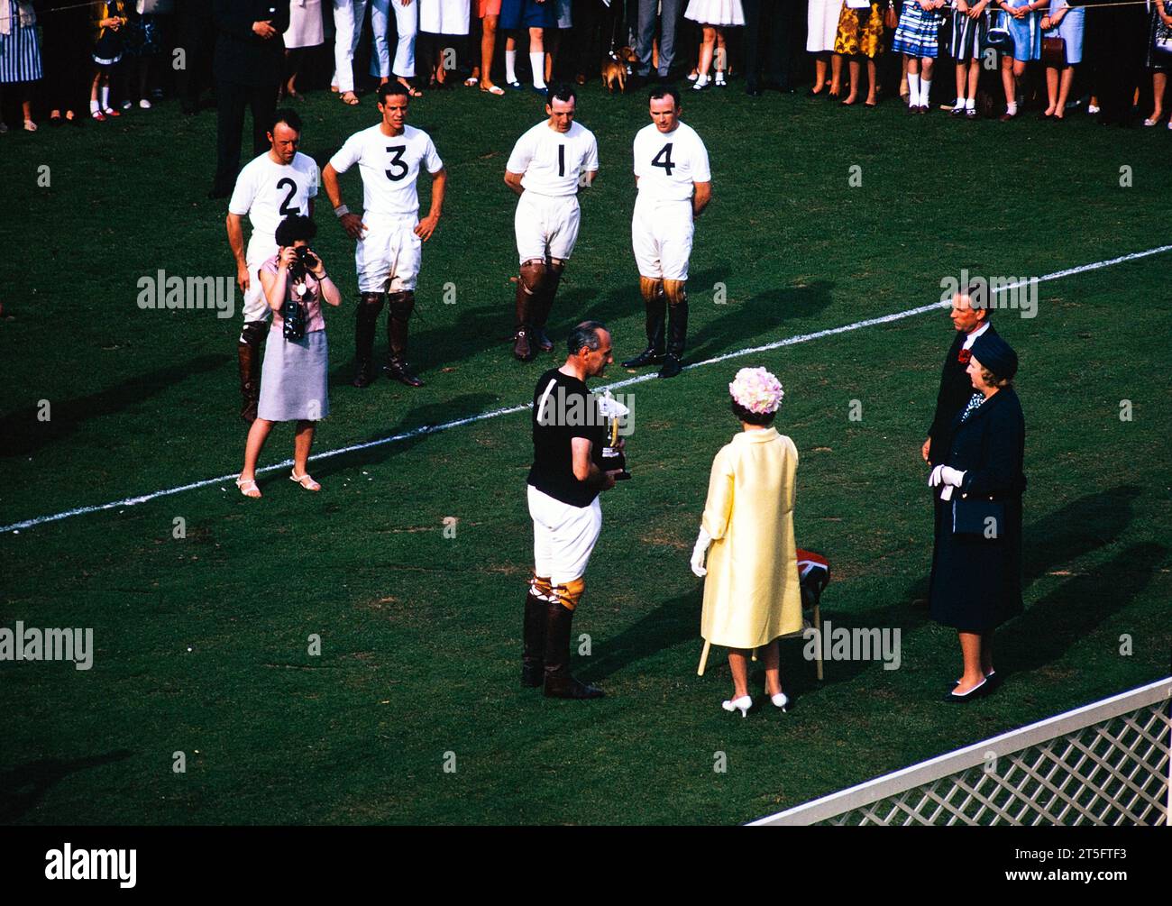 Queen Elizabeth giving prize at polo event, August 1966 Stock Photo - Alamy