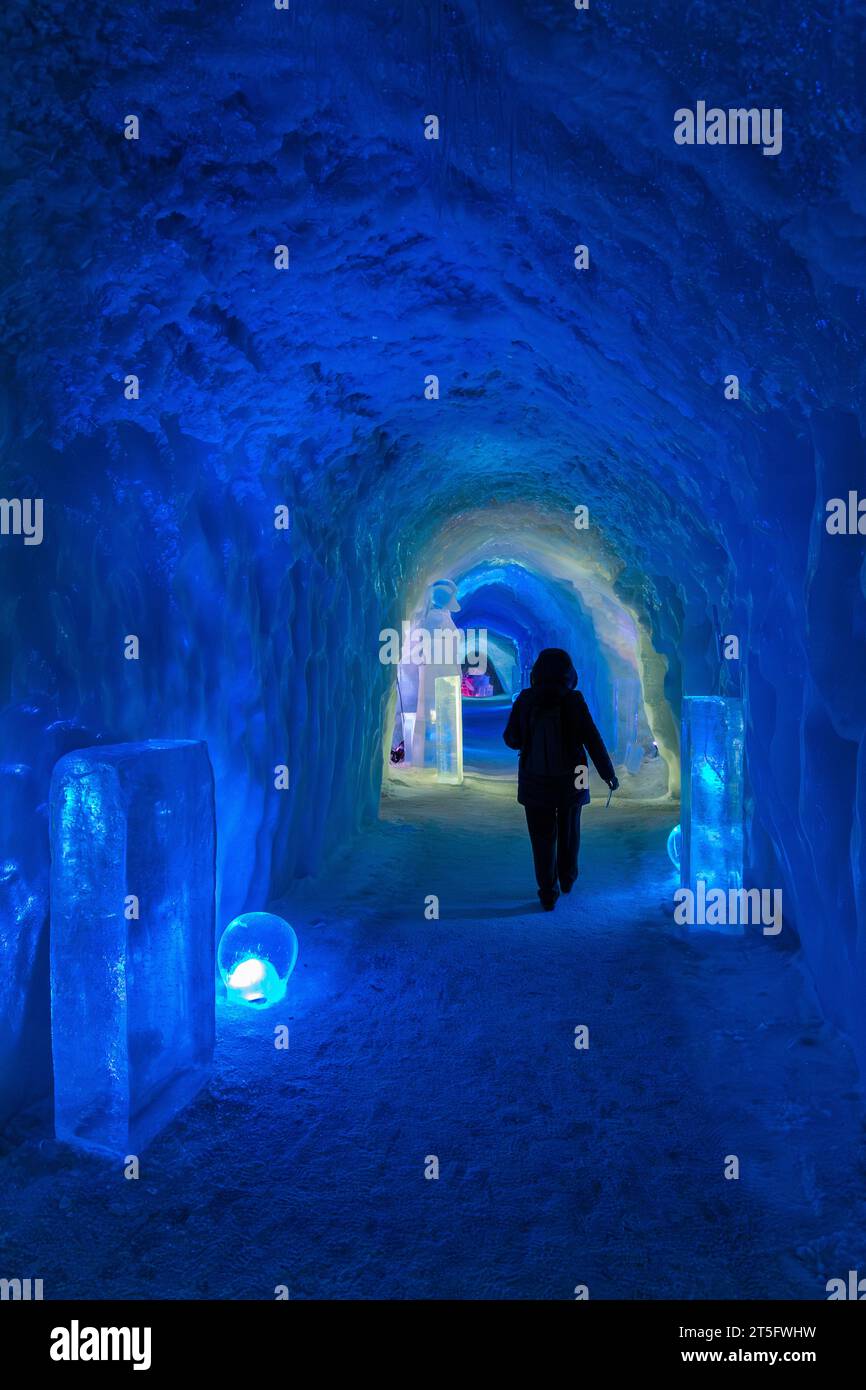Visitor walking along corridor inside the Snowhotel Ice Hotel at ...
