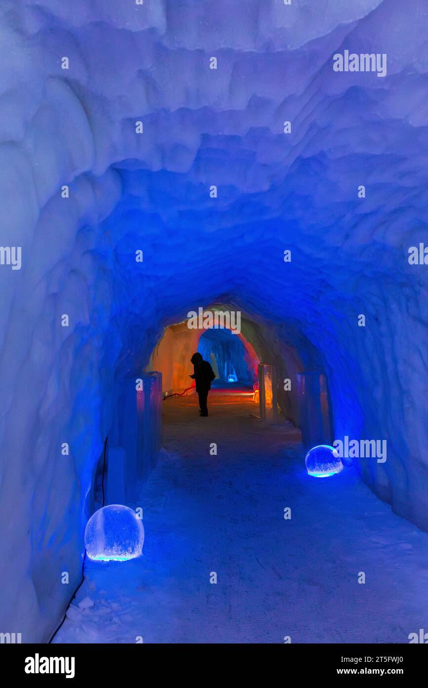 Visitor walking along corridor inside the Snowhotel Ice Hotel at ...