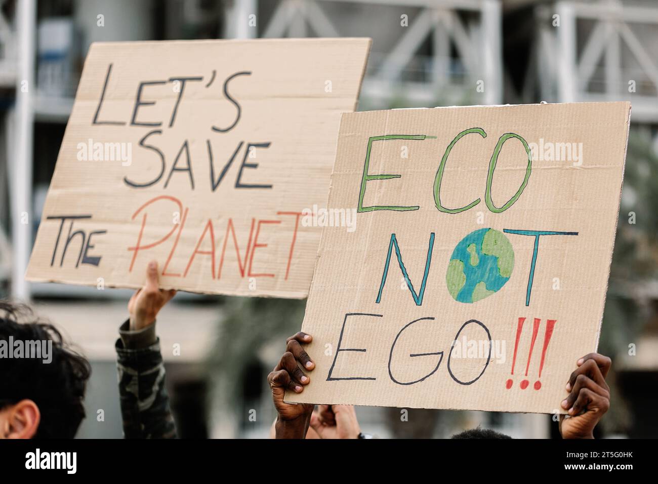 Group of activist people holding placards and banners for climate ...