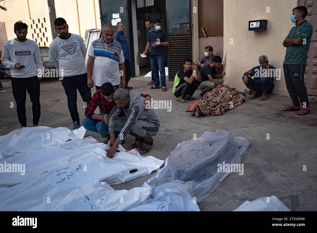 Palestinians mourn their relatives killed in the Israeli bombardment of ...