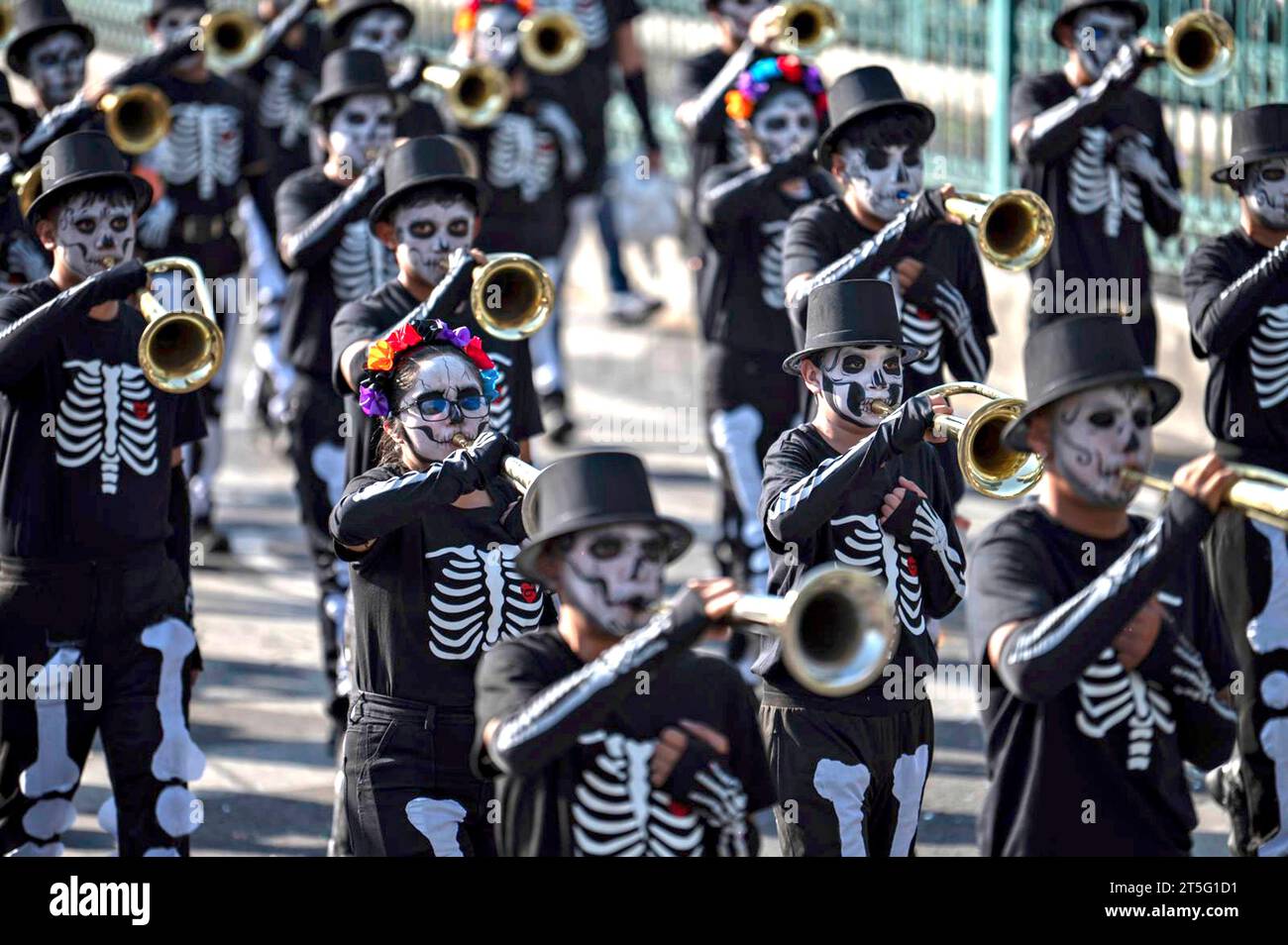 Mexico City, Mexico. 04th Nov, 2023. A skeleton brass band marches down ...