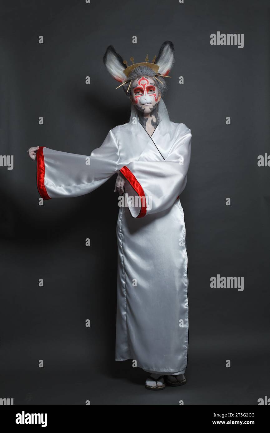 Dancing woman actress with stage makeup in mask and kimono costume ...