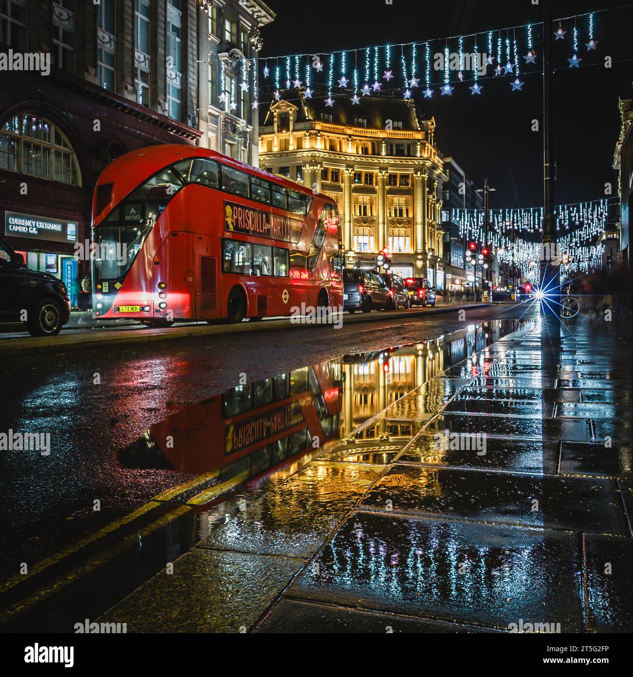 Reflections of the traffic and christmas lights on Oxford Street in ...