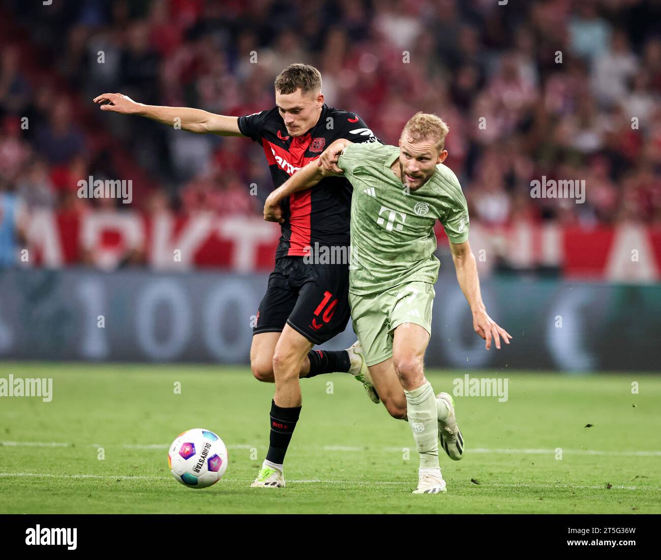 Florian Wirtz of Bayer Leverkusen Konrad Laimer of Bayern Muenchen FC ...