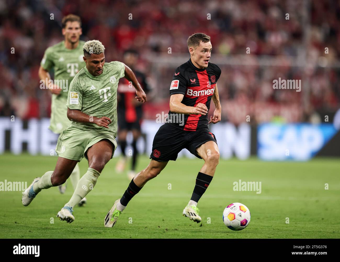 Florian Wirtz of Bayer Leverkusen Serge Gnabry of Bayern Muenchen FC ...