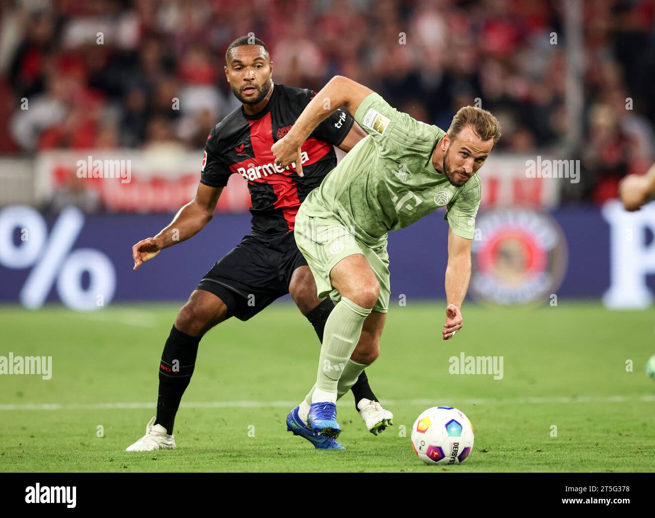 Jonathan Tah of Bayer Leverkusen Harry Kane of Bayern Muenchen FC ...