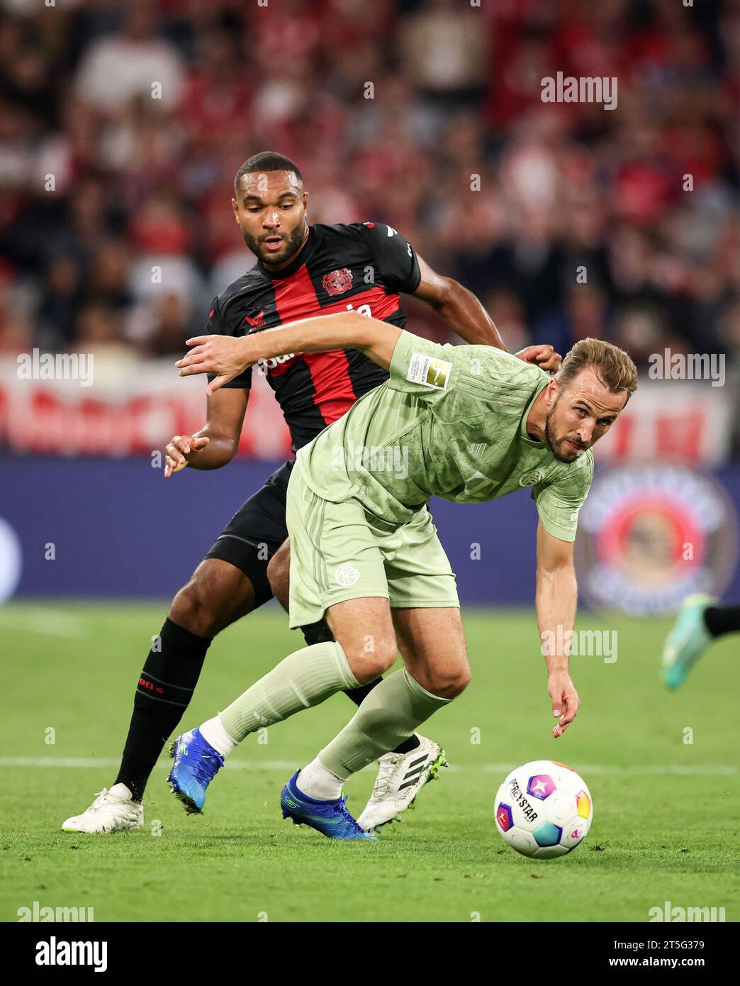 Jonathan Tah of Bayer Leverkusen Harry Kane of Bayern Muenchen FC ...