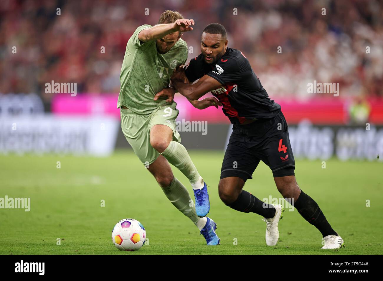Harry Kane of Bayern Muenchen Jonathan Tah of Bayer Leverkusen FC ...