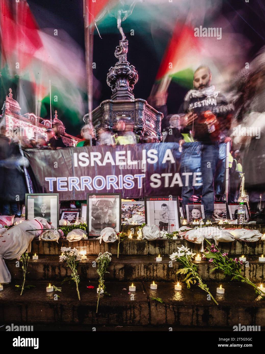 "Israel is a terrorist state" sign at a pro Palestine vigil under ...