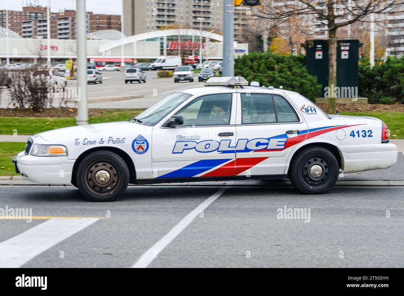 Toronto, Canada, 2013, A police patrol vehicle driving on a city street ...
