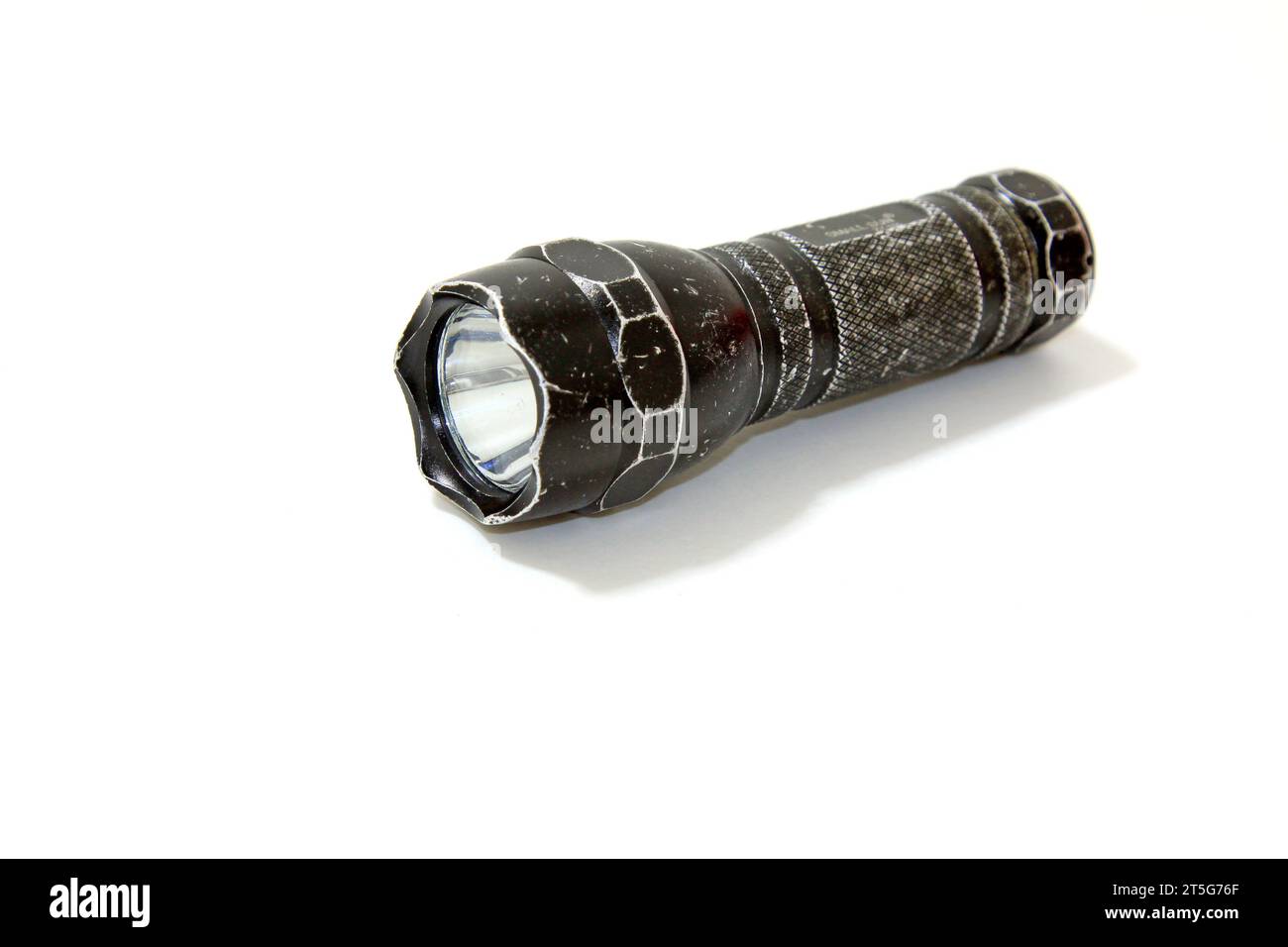 Old-fashioned pocket flashlight on a white background Stock Photo - Alamy